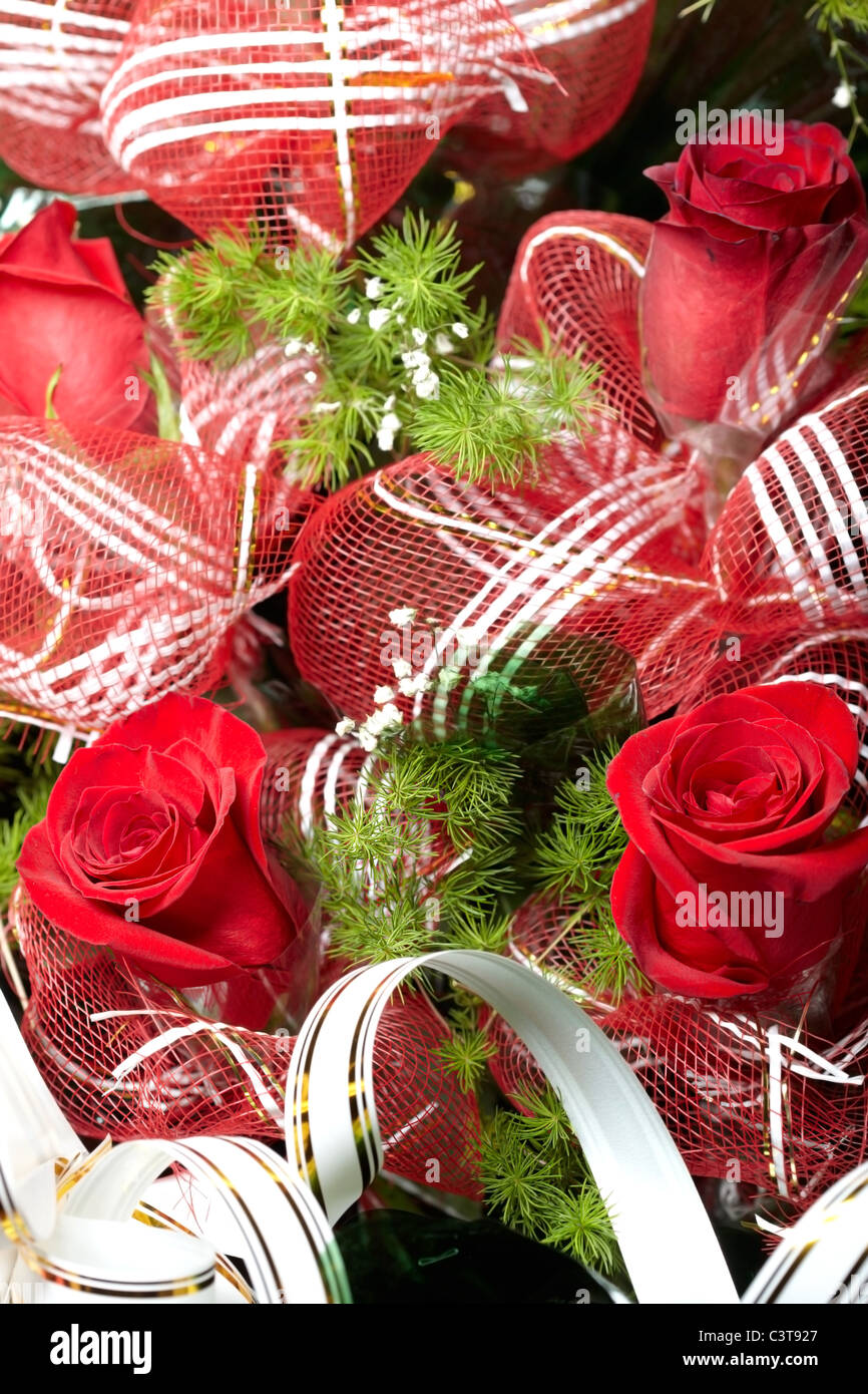 Three roses in the flower bunch. Close-up photo with natural light and ...