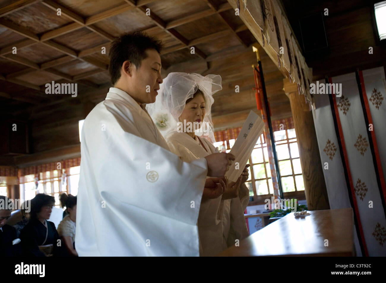 Young Japanese couple getting married in a Shinto Temple, Oomi shrine ...