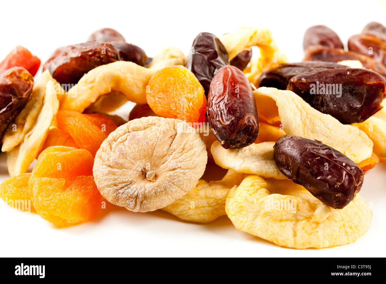 Closeup of dried fruits mix isolated on white background Stock Photo ...