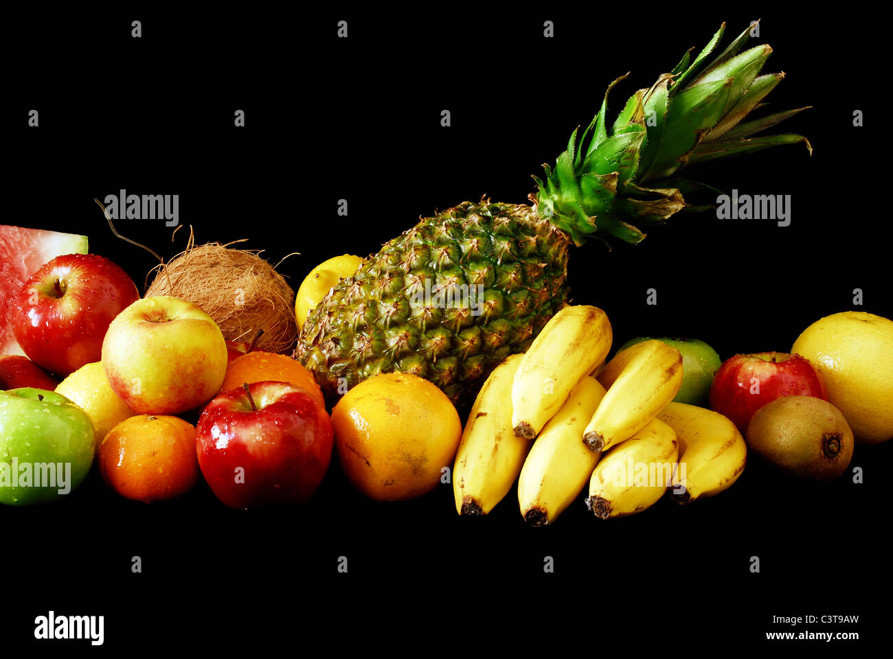 Colorful fresh fruit assortment on black background Stock Photo - Alamy