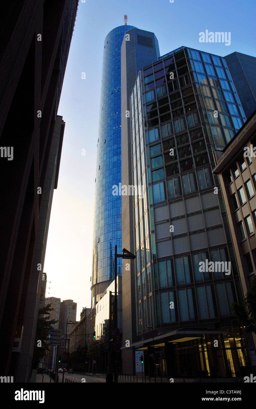 Golden and blue skyscraper reflecting a blue sky. Frankfurt, Germany ...