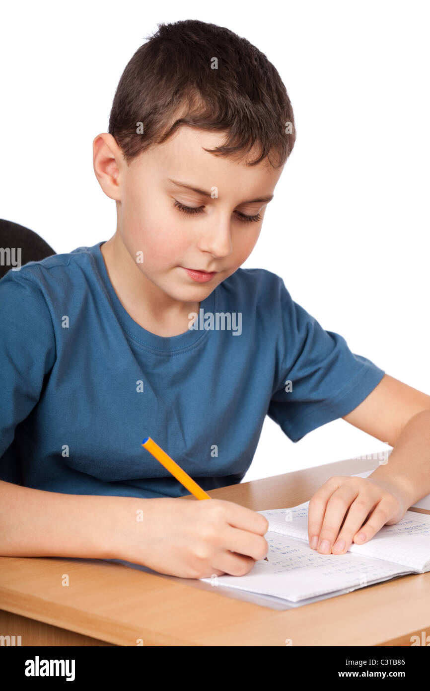 Schoolboy doing his homework at his desk Stock Photo - Alamy