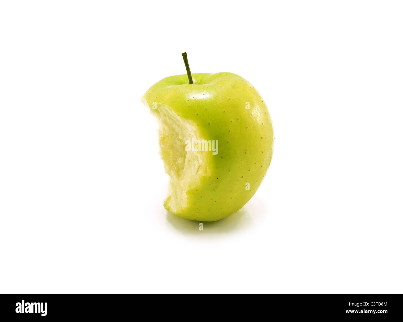 green apple with a bite Stock Photo - Alamy