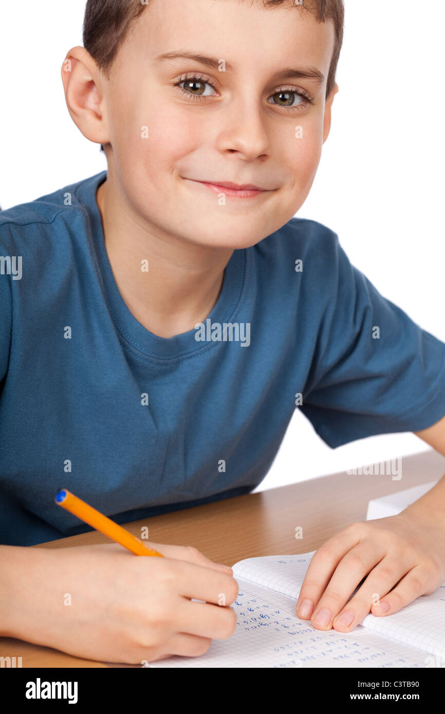 Schoolboy doing his homework at his desk Stock Photo - Alamy