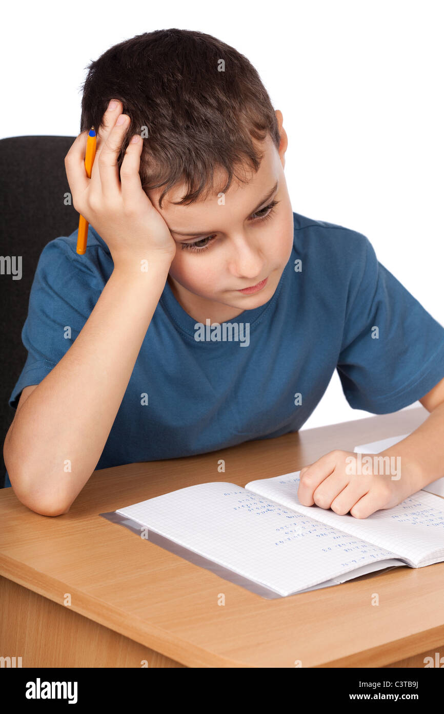 Schoolboy being stressed by his homework, isolated on white background ...