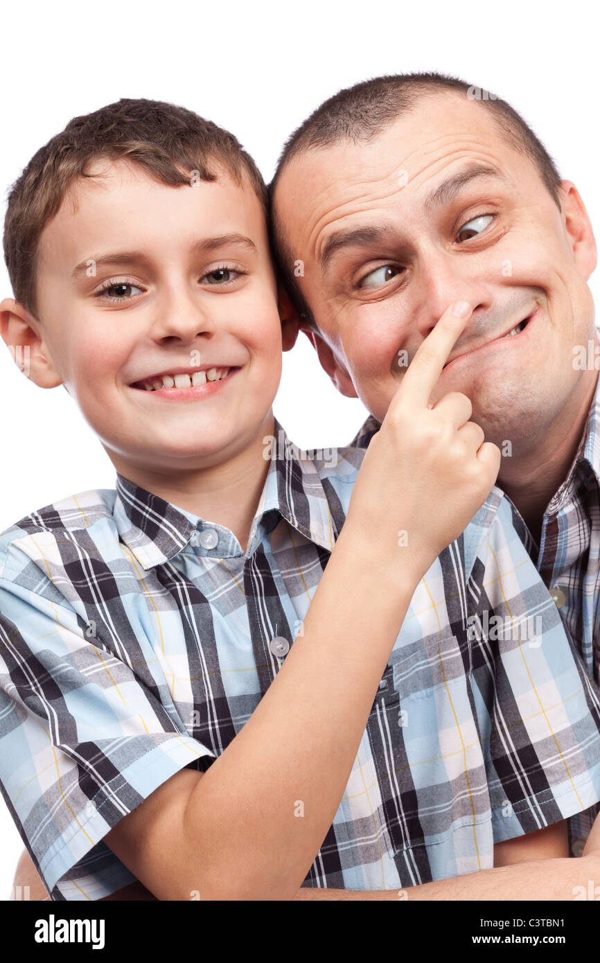 Cute kid and his dad making funny faces, isolated on white background ...
