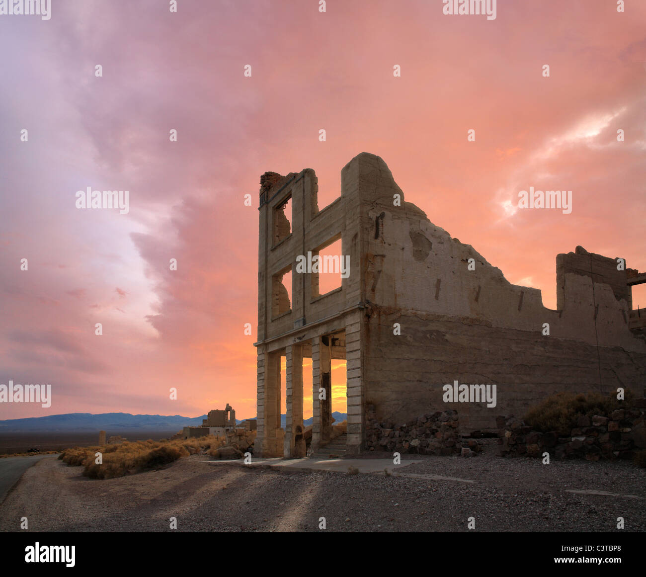 A Crumbling Structure Under Restless Sunset Skies At Rhyolite Nevada ...