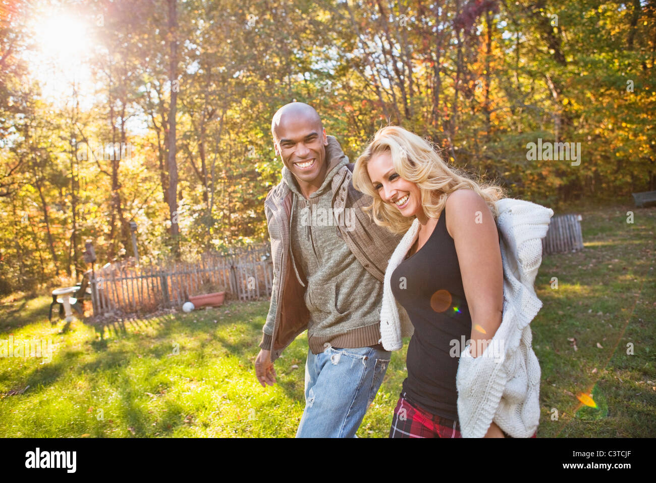 Young couple walking away from camera hi-res stock photography and ...