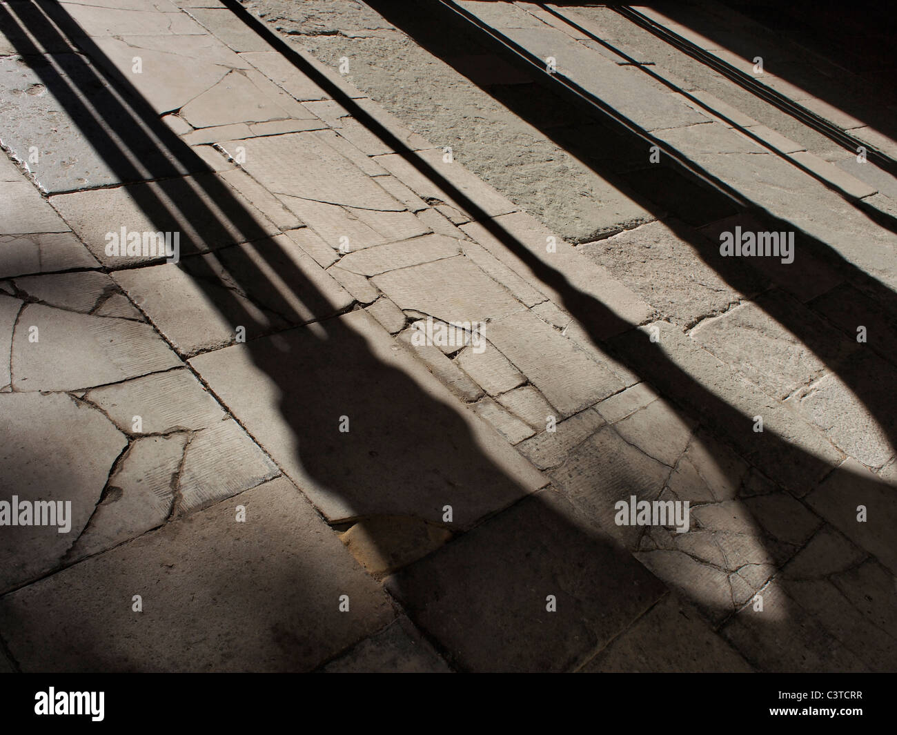Shadows cast by stone pillars in Salisbury Cathedral Cloisters Stock ...