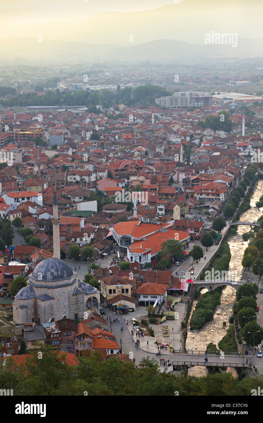 city Prizren in Kosovo at sunset with red roofed houses and mosques and ...