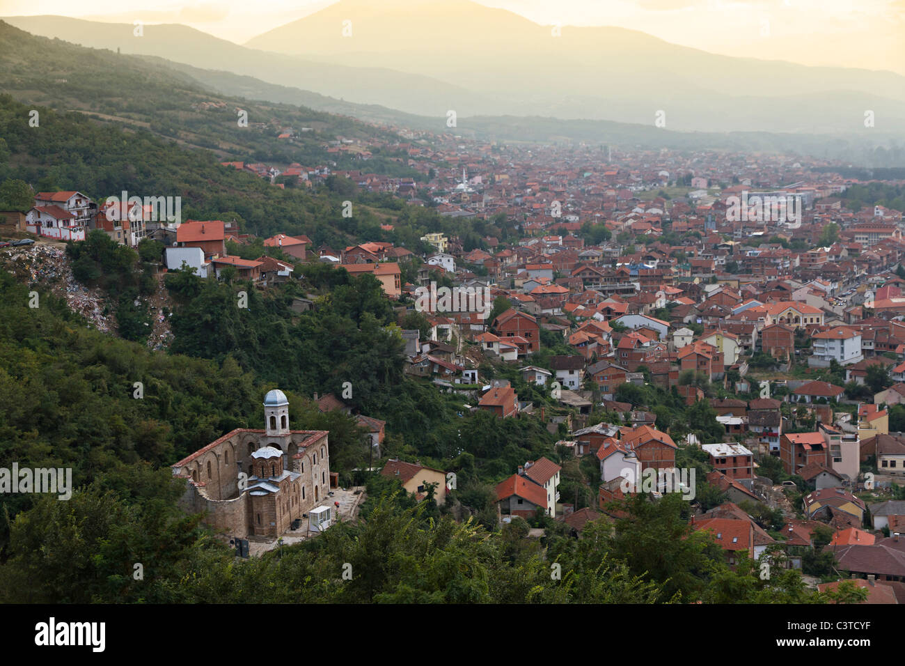 Prizren in Kosovo at sunset with red roofed houses, mosques and during ...