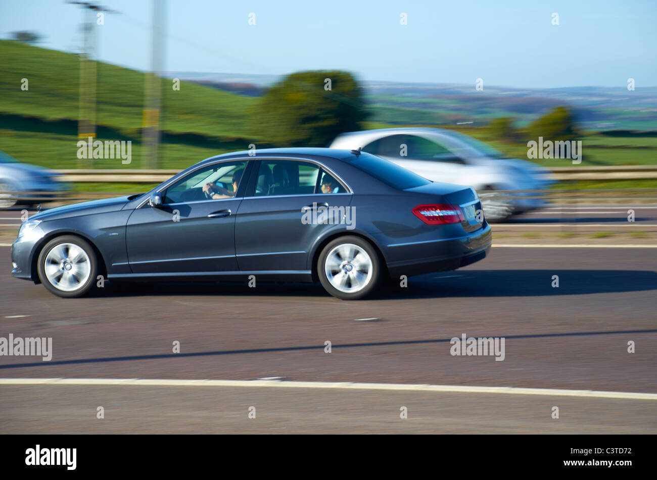 Blue Mercedes saloon on the M62 Stock Photo - Alamy