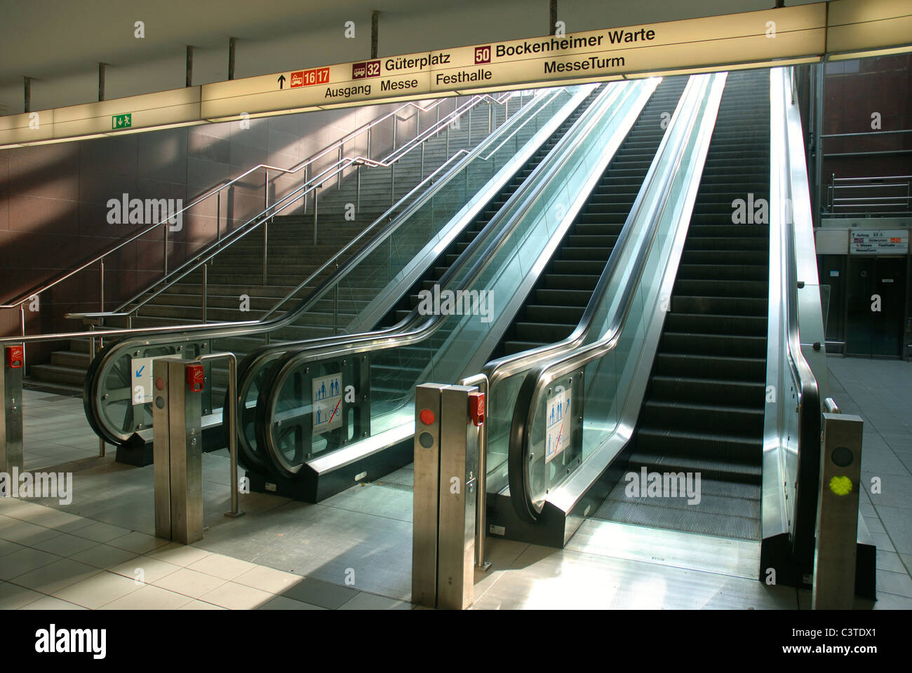 Moving escalators entrance Stock Photo - Alamy