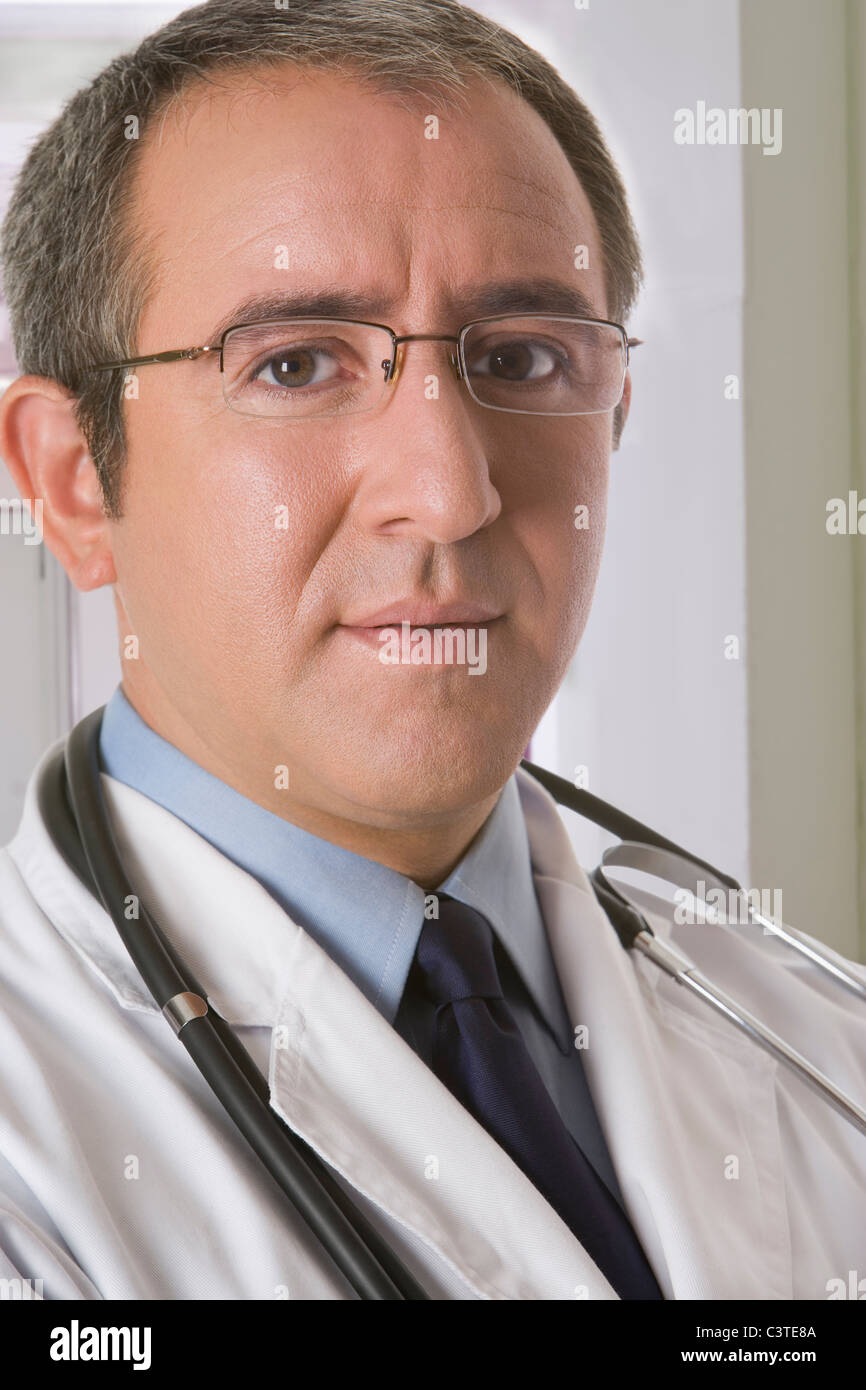 Serious Hispanic doctor Stock Photo - Alamy