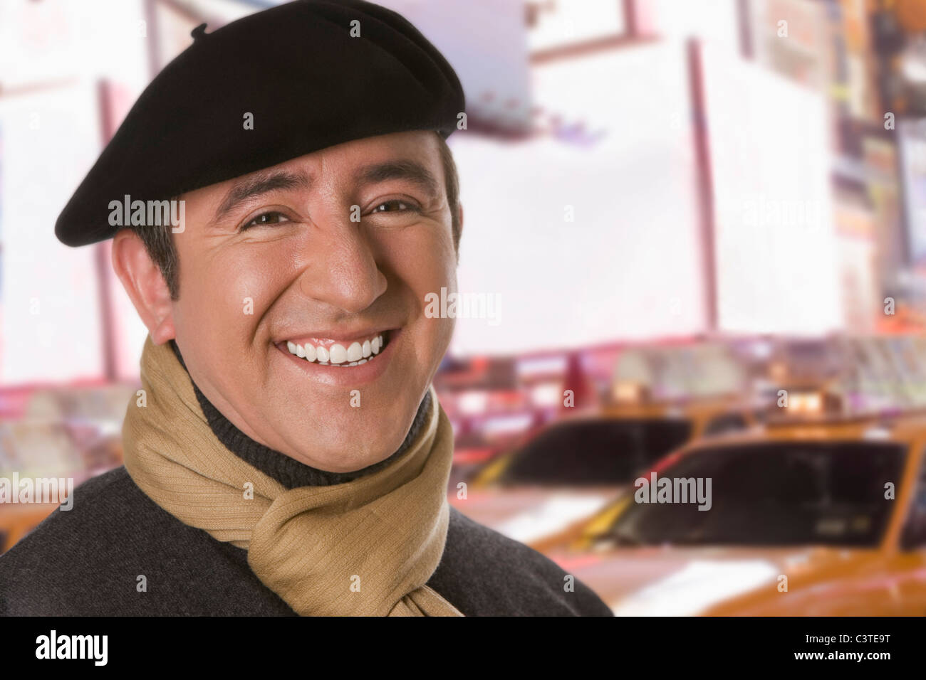 Hispanic man in beret on city street Stock Photo - Alamy