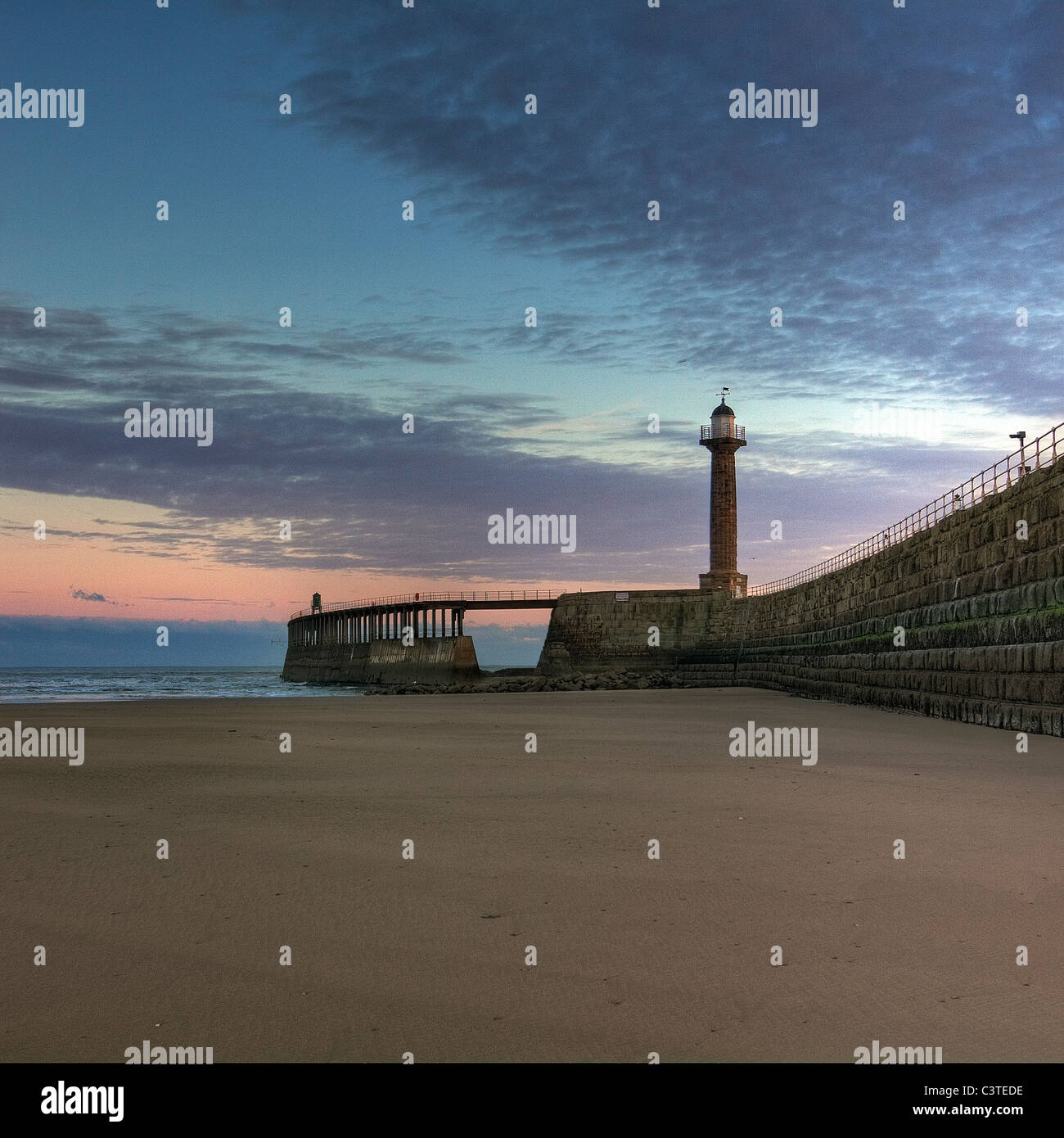 Beach harbour wall lighthouse hi-res stock photography and images - Alamy