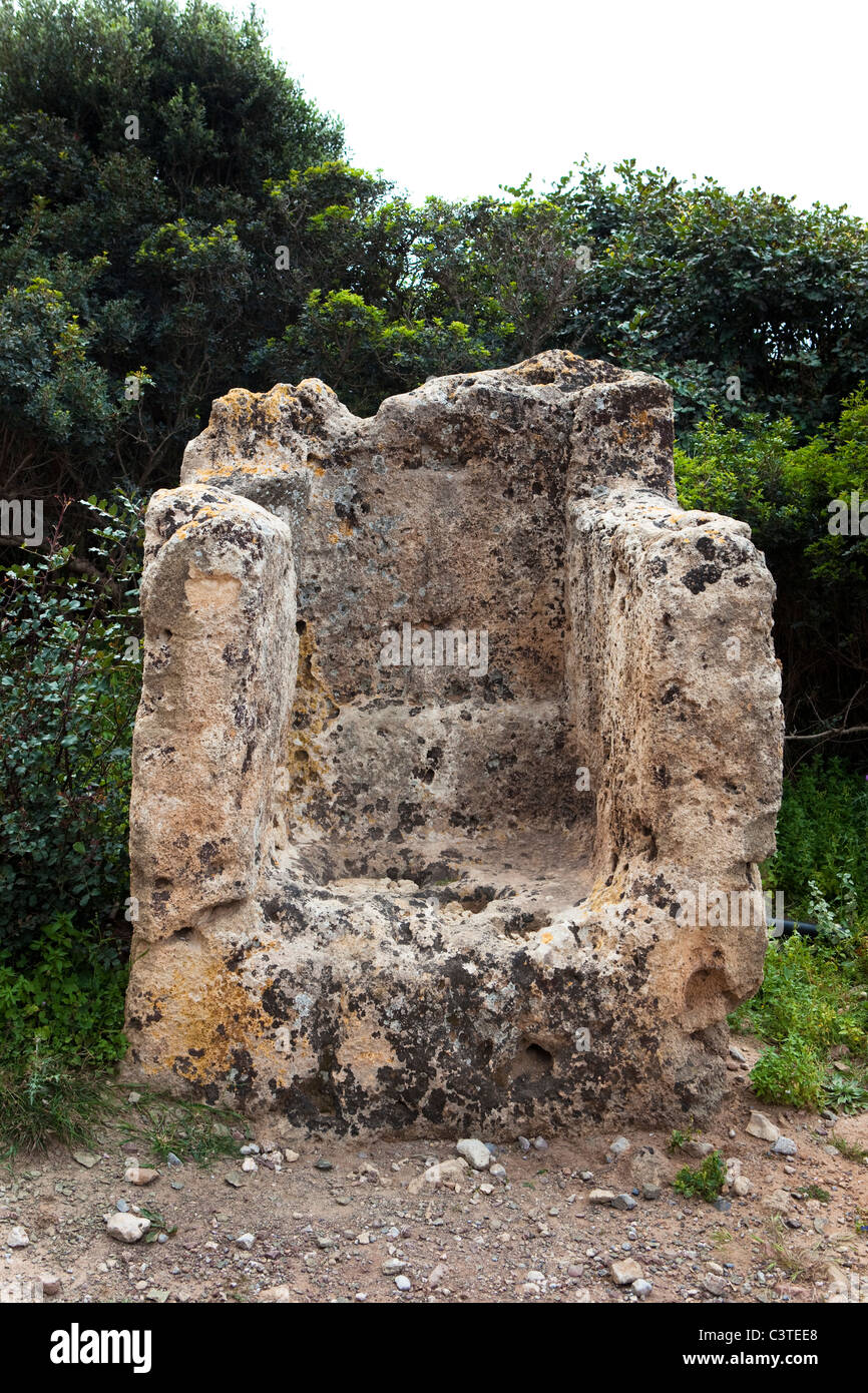 The throne carved from rock at Ancient Falassarna, Crete Stock Photo ...
