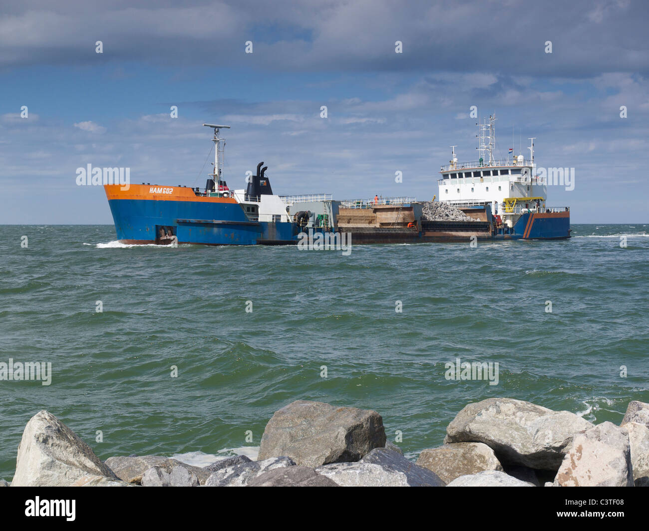 Ship on the North Sea carrying stones for the Maasvlakte 2 construction ...