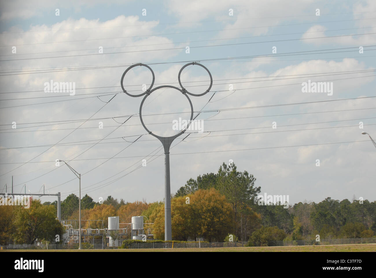 A utility pole shaped in the appearance of Mickey Mouse graces ...