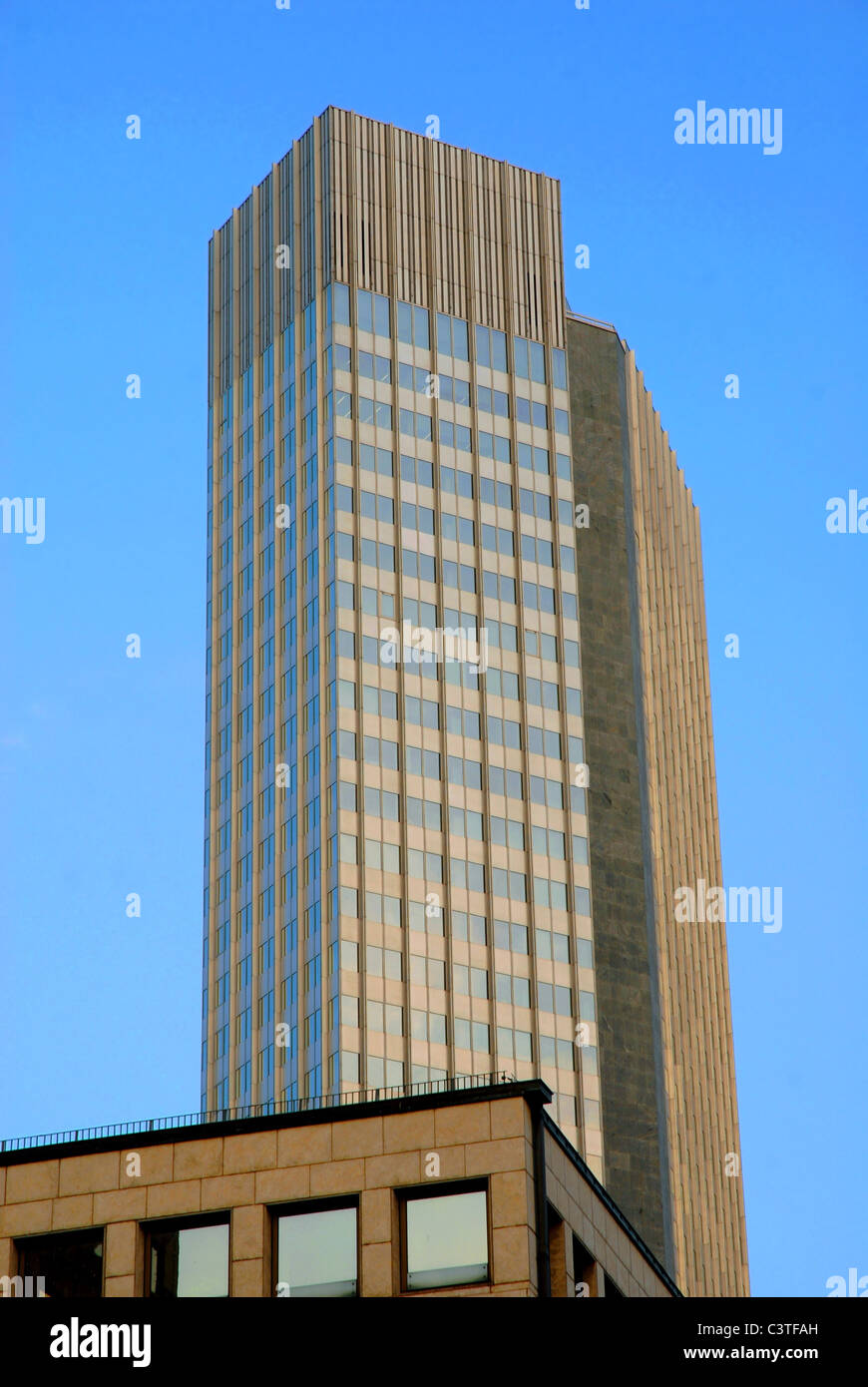 Urban Scene. Top of modern skyscrapers with a smaller building in the ...