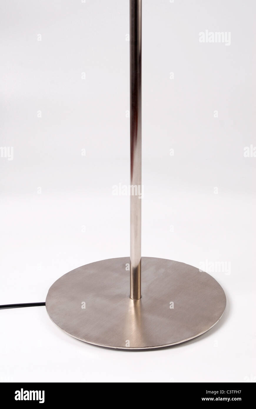 Close up of the bottom of a contemporary floor lamp. Isolated on white ...