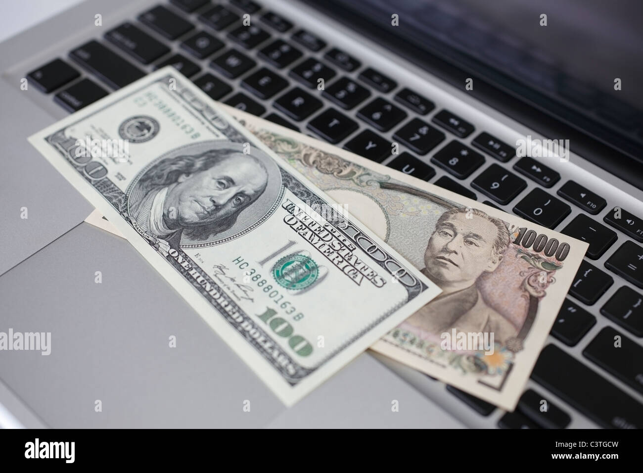 Computer keyboard and money Stock Photo - Alamy