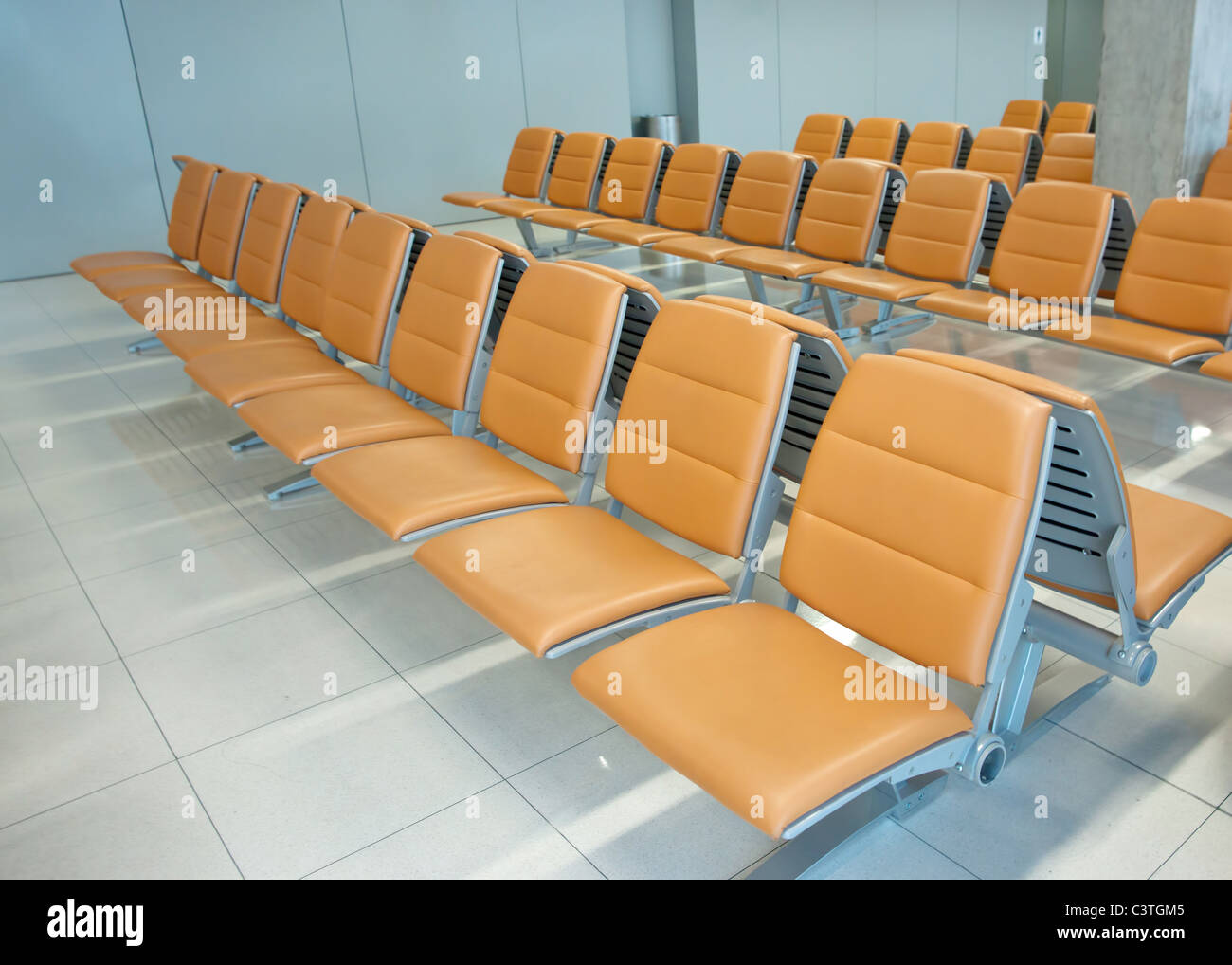 orange yellow airport bus or train waiting seats in rows Stock Photo ...