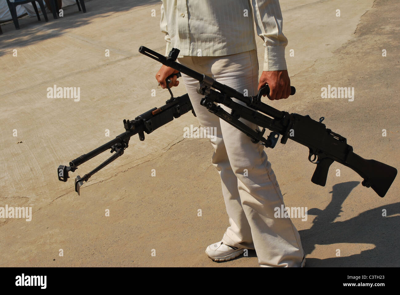 man carrying rifle Stock Photo - Alamy