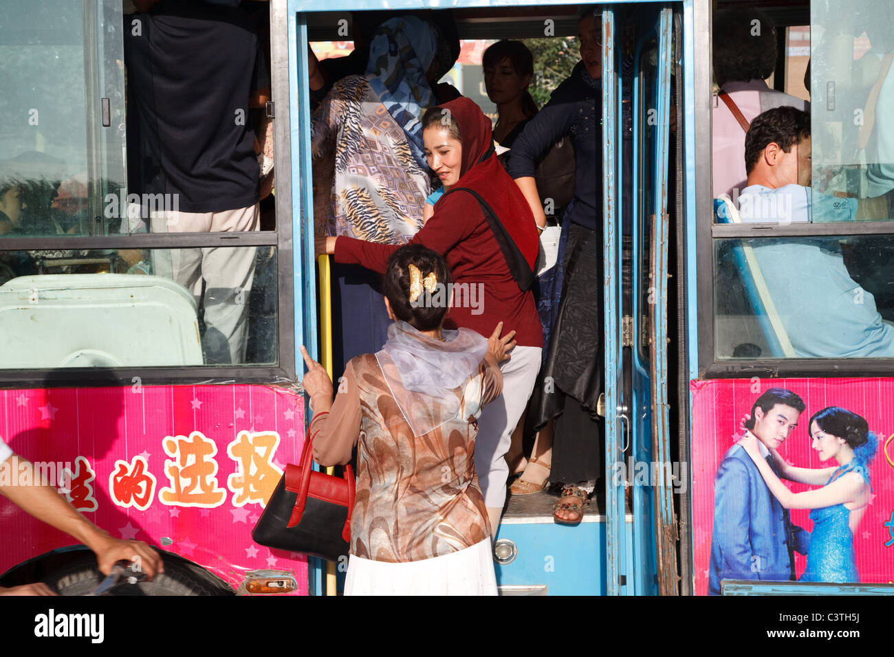 Crowded public bus with passengers in Urumqi, Xinjiang, China Stock ...