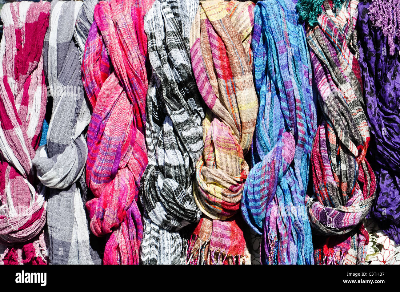 a set of colorful scarves on a rack on a local market in vienna Stock ...