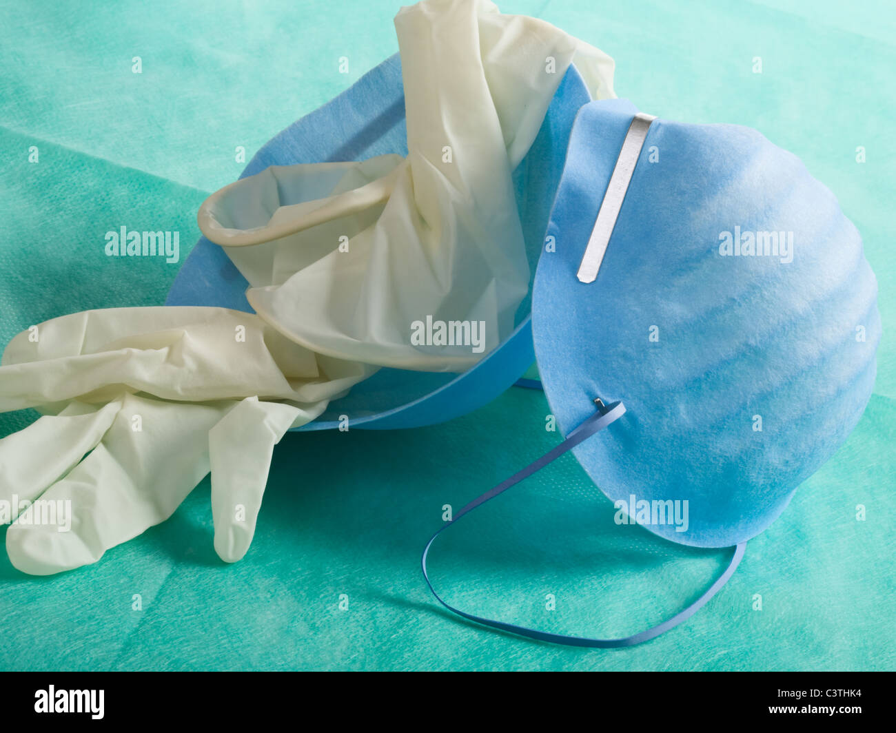 Two surgical masks and surgical gloves on surgical cloth Stock Photo ...