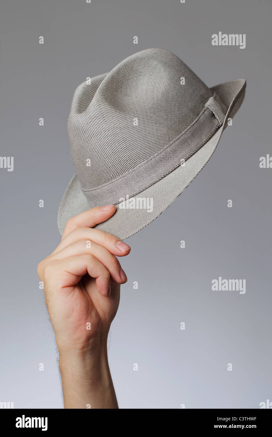 Man holding a vintage trilby hat in his hand Stock Photo - Alamy