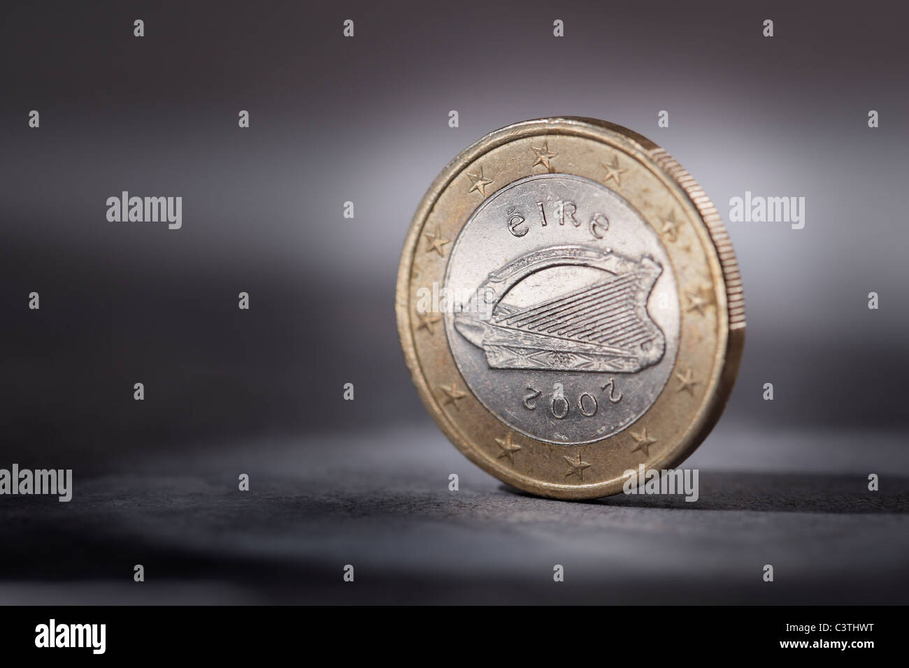A Worn Irish Euro coin on grey. Short depth of field Stock Photo - Alamy