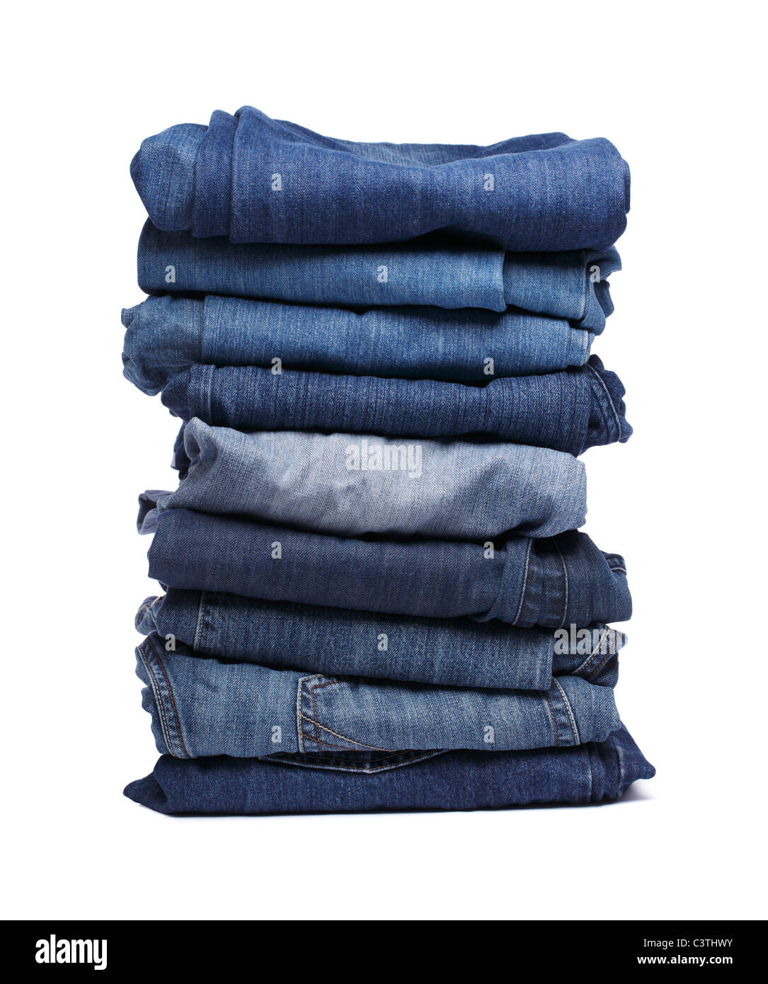Stack of blue jeans pants isolated on white with natural shadows Stock ...