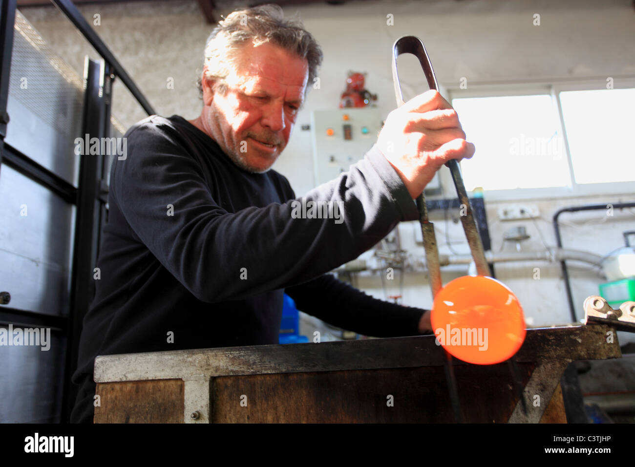 Robert Pierini and his son are both glass blower master. They are ...