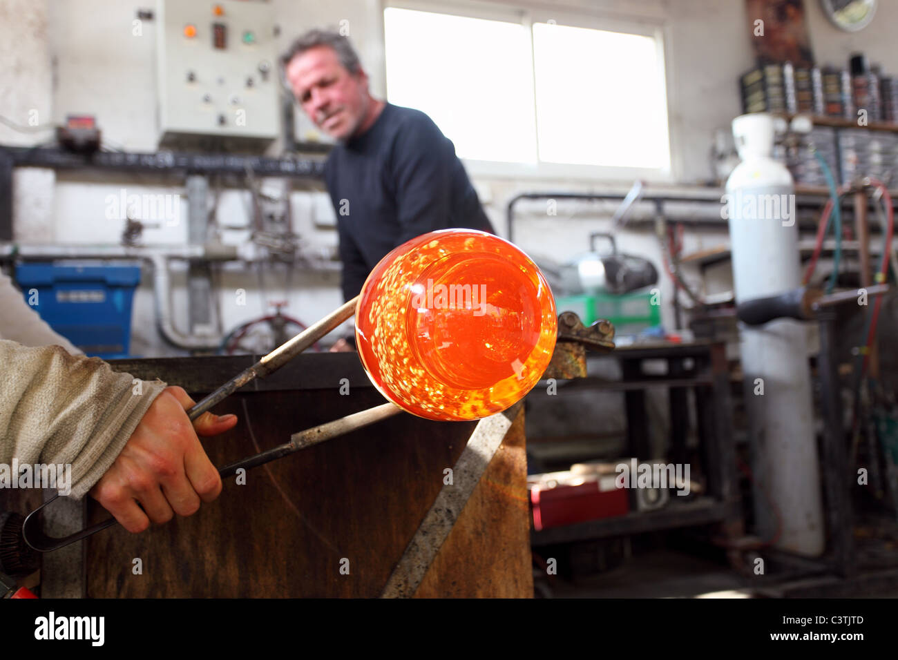 Robert Pierini and his son are both glass blower master. They are ...