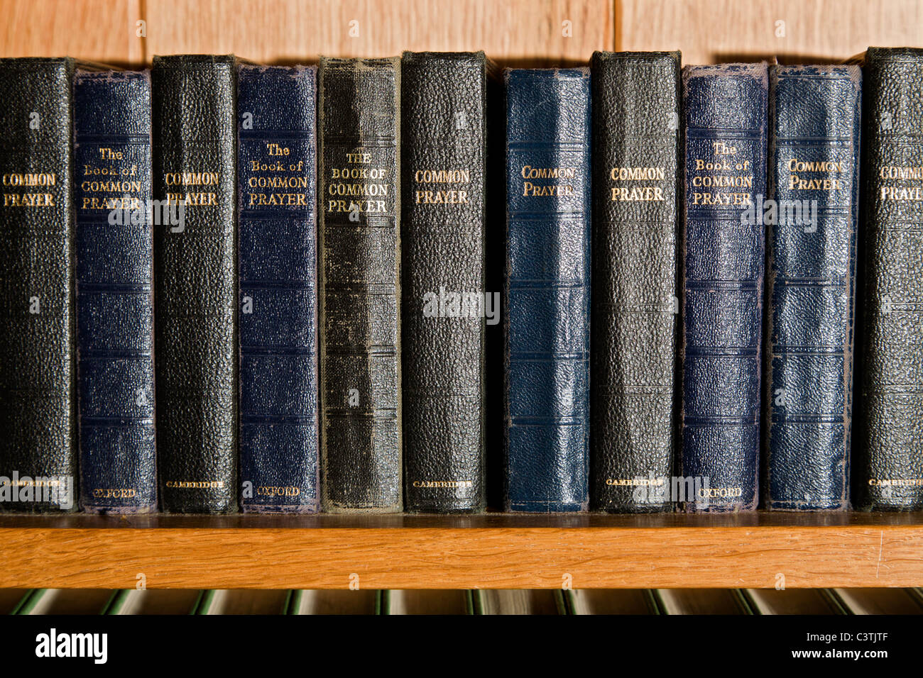 A row of Common Prayer books on church bookshelf. Norfolk, England, UK ...