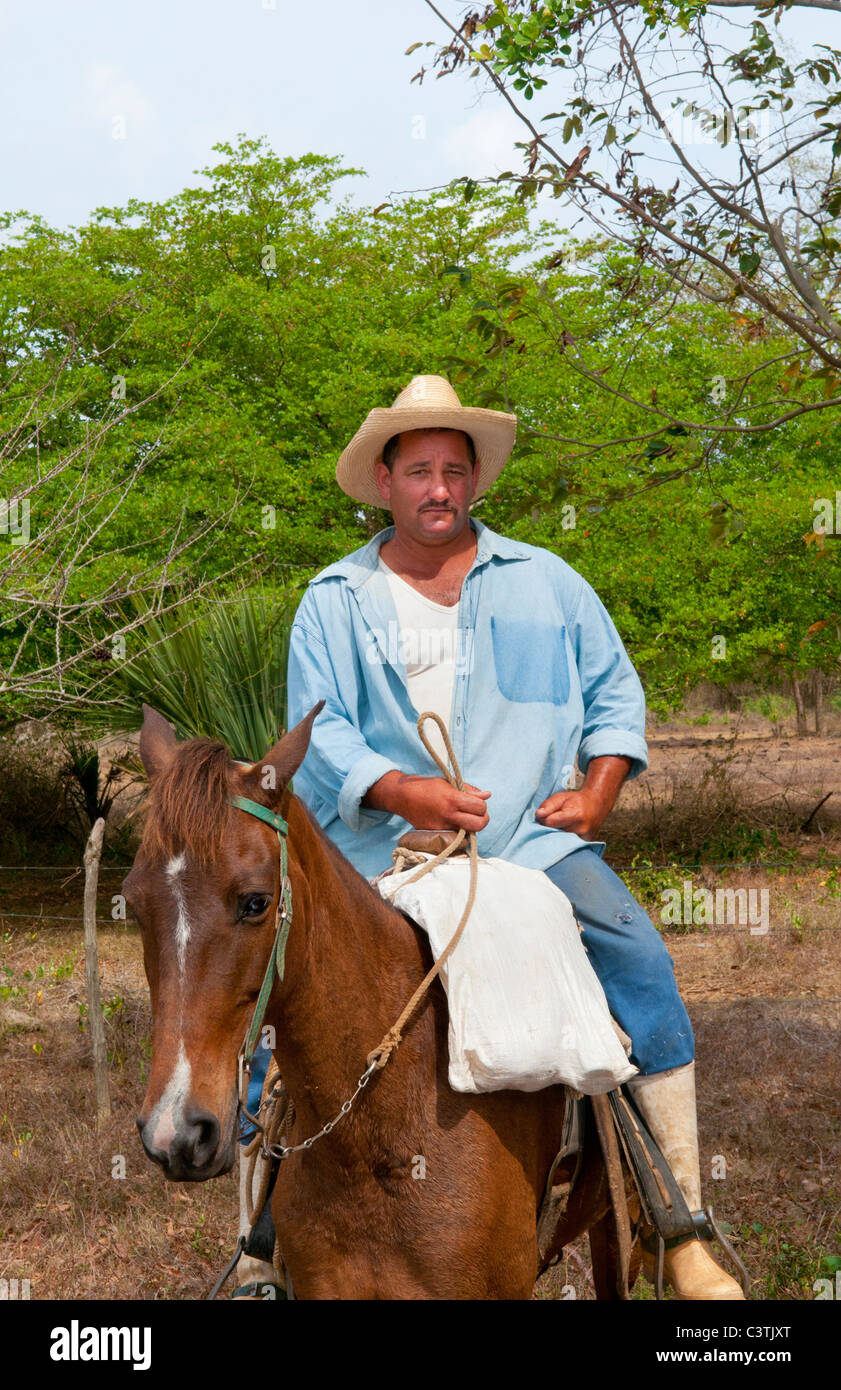 Cuban cowboy on horse in rural country near Trinidad Cuba Stock Photo ...