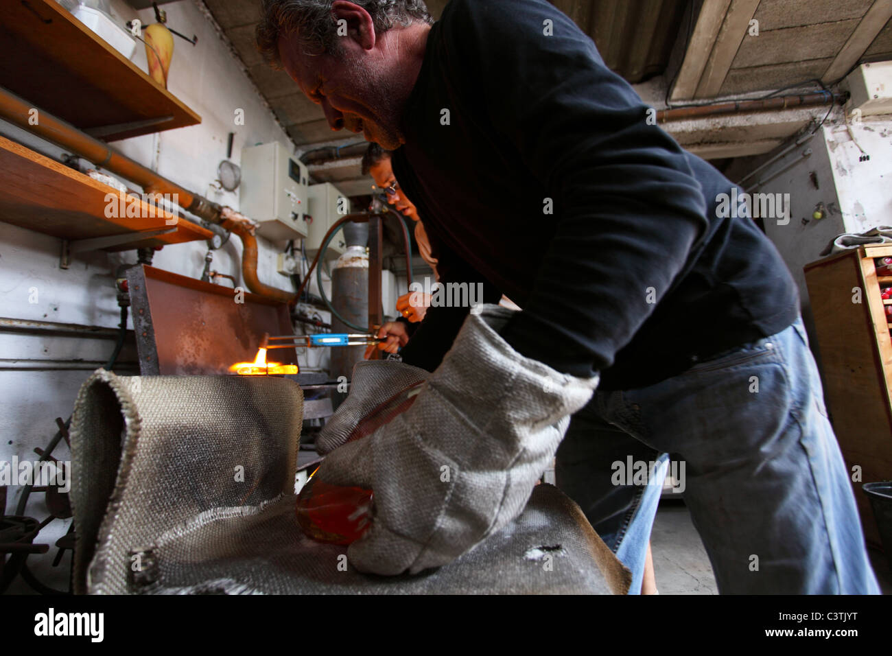 Robert Pierini and his son are both glass blower master. They are ...