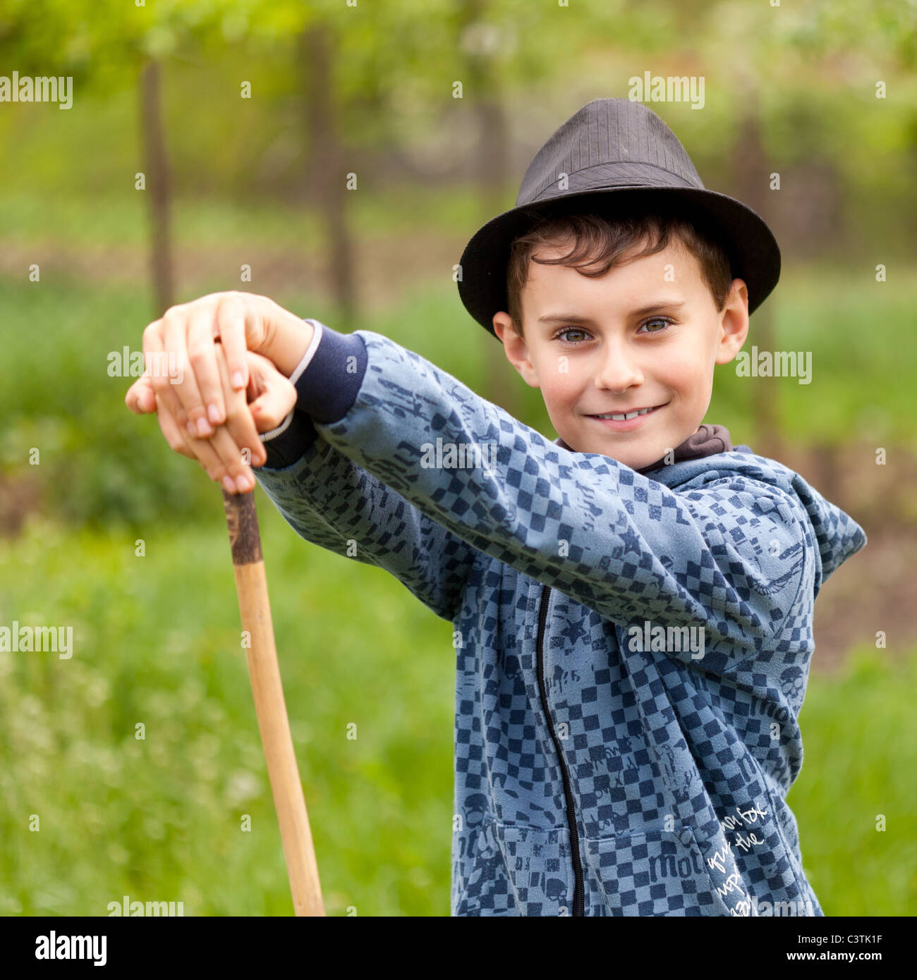 Portrait of a little boy with cane and hat outdoor Stock Photo - Alamy