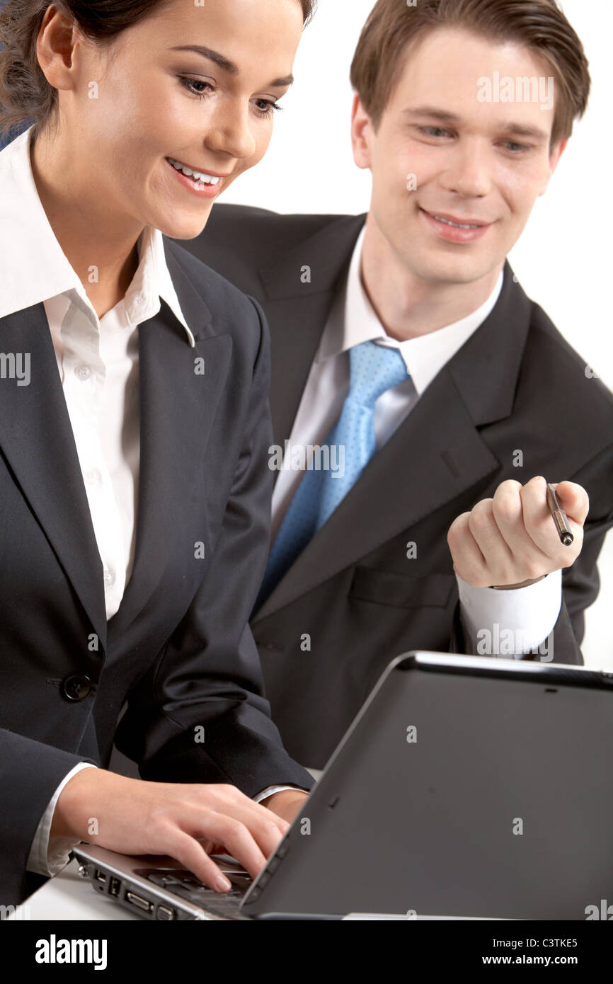 A woman typing on laptop by her chief Stock Photo - Alamy