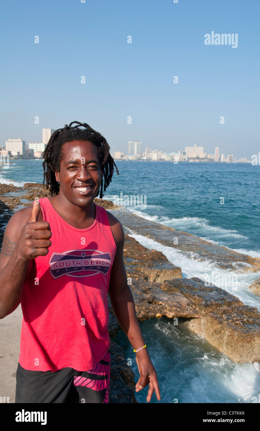 Local dreadlocked black man at famous malecon on ocean shore water in ...