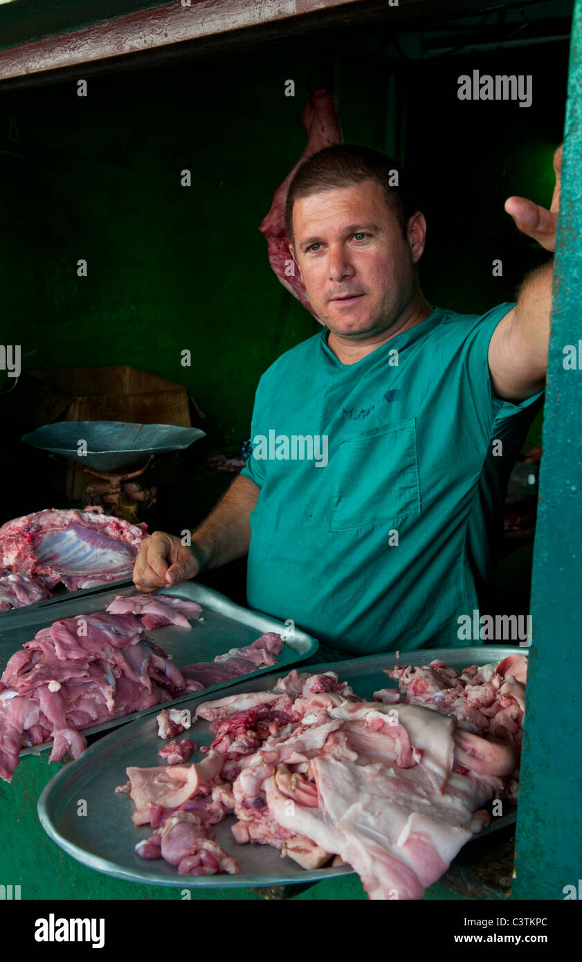 Local butcher window selling meat and pork in local capital in Havana ...