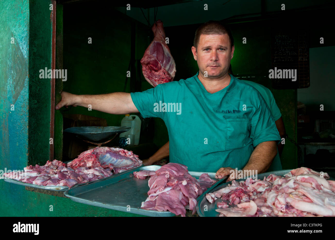 Local butcher window selling meat and pork in local capital in Havana ...