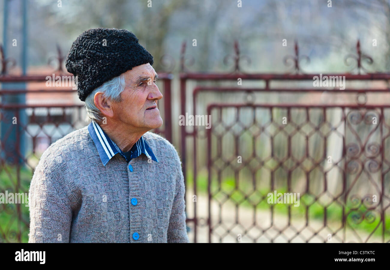Senior rural man outdoor, near a gate Stock Photo - Alamy