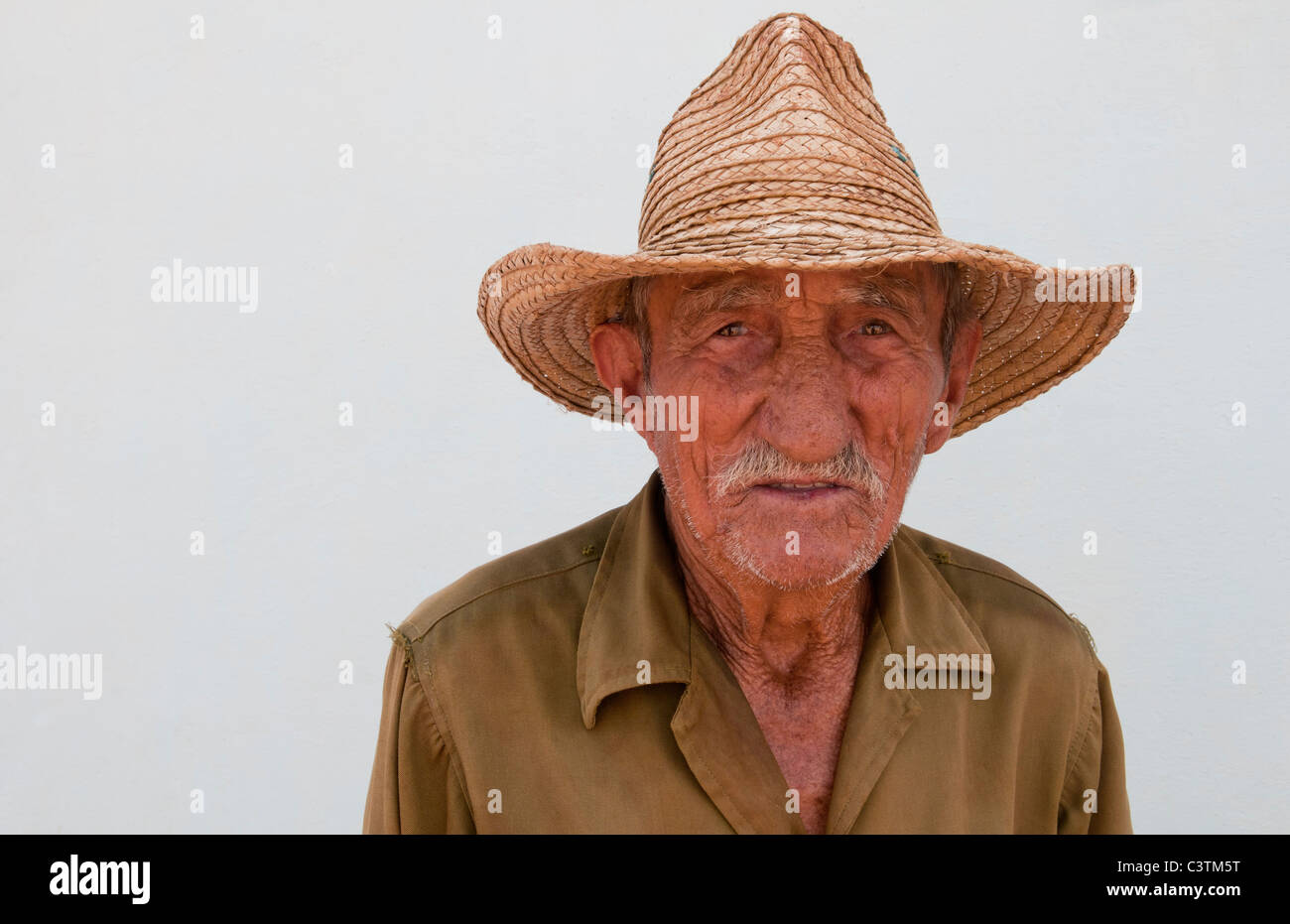 Portrait of poor man with straw hat in small town of Australia Cuba ...