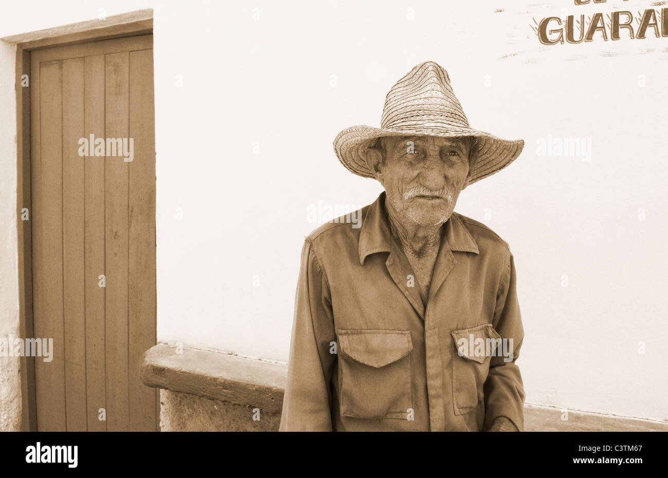 Portrait of poor man with straw hat in small town of Australia Cuba ...