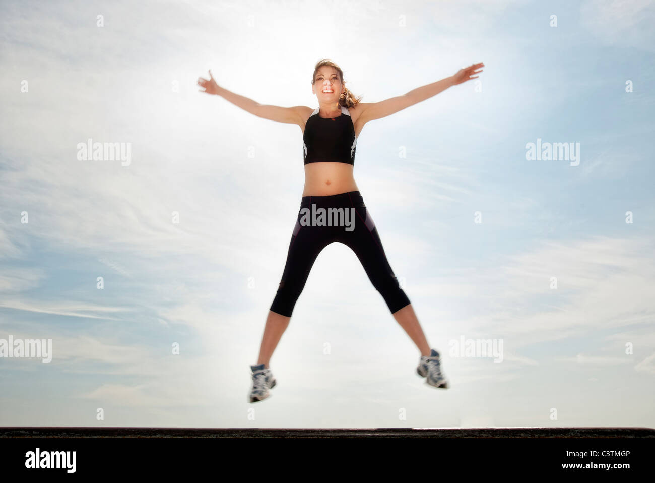 Star jump woman hi-res stock photography and images - Alamy