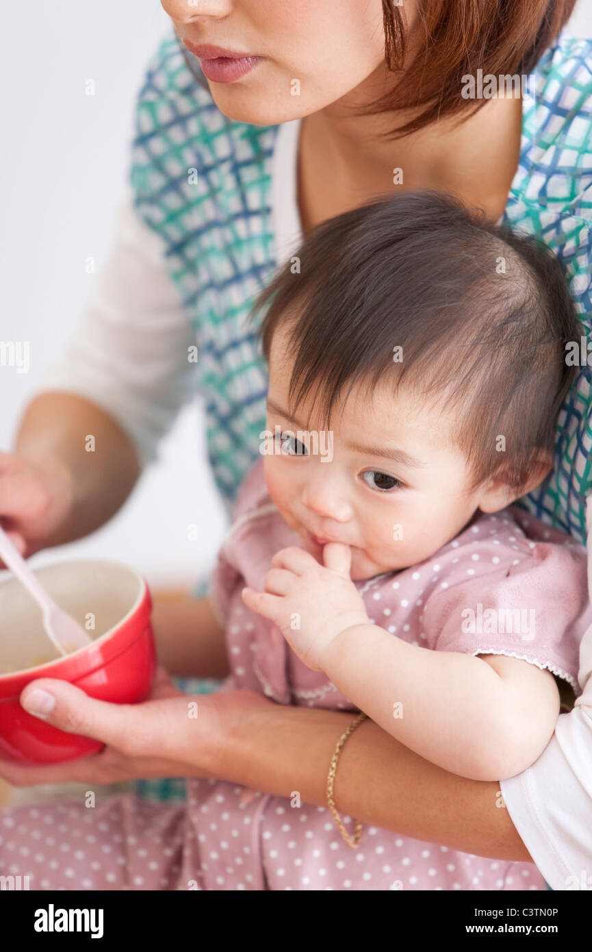 Baby Being Fed Stock Photo - Alamy