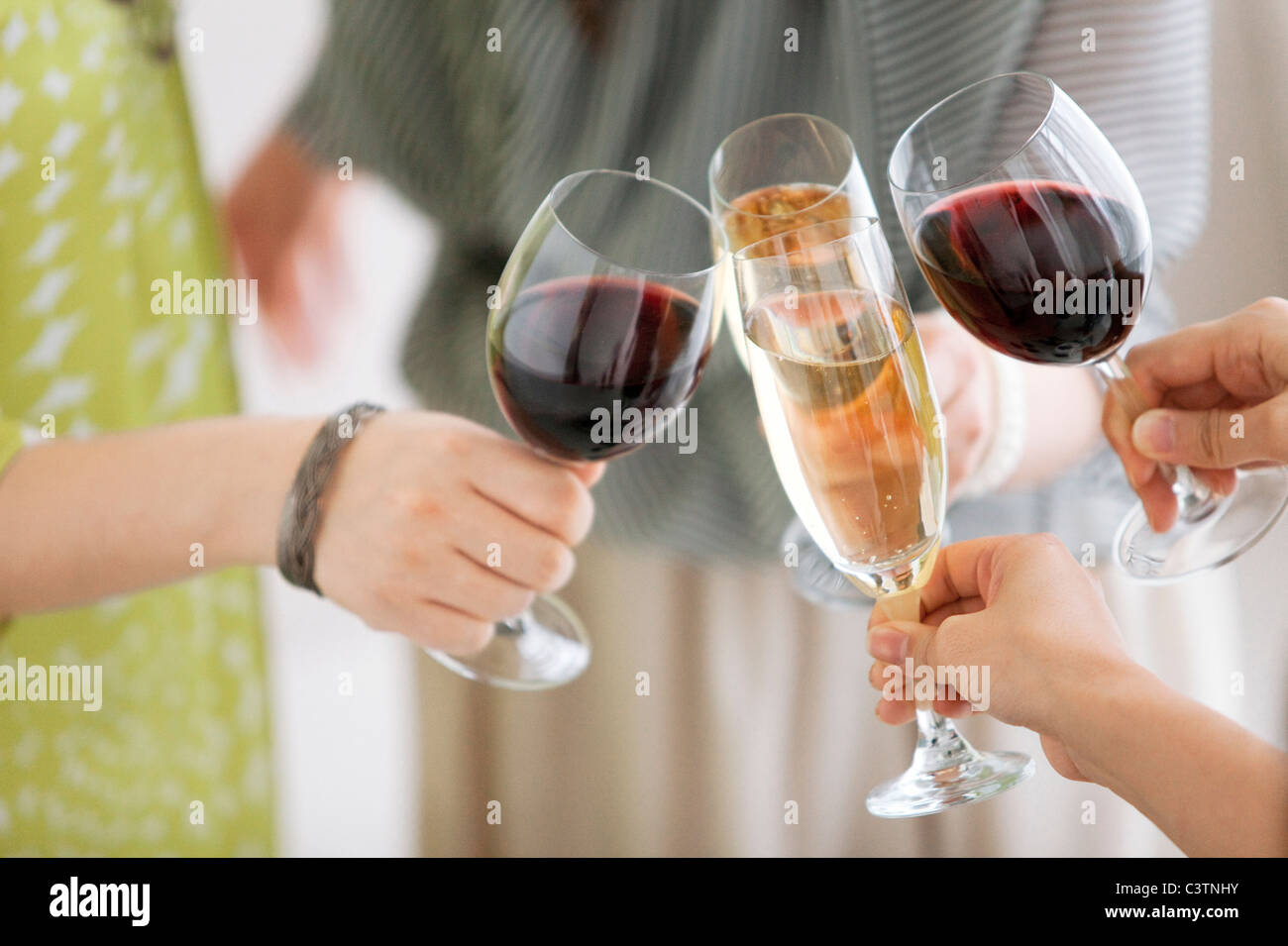 Women Toasting with Wine Stock Photo - Alamy